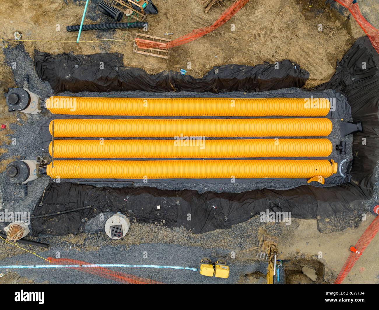 Yellow underground storm water detention mitigation units on a ...