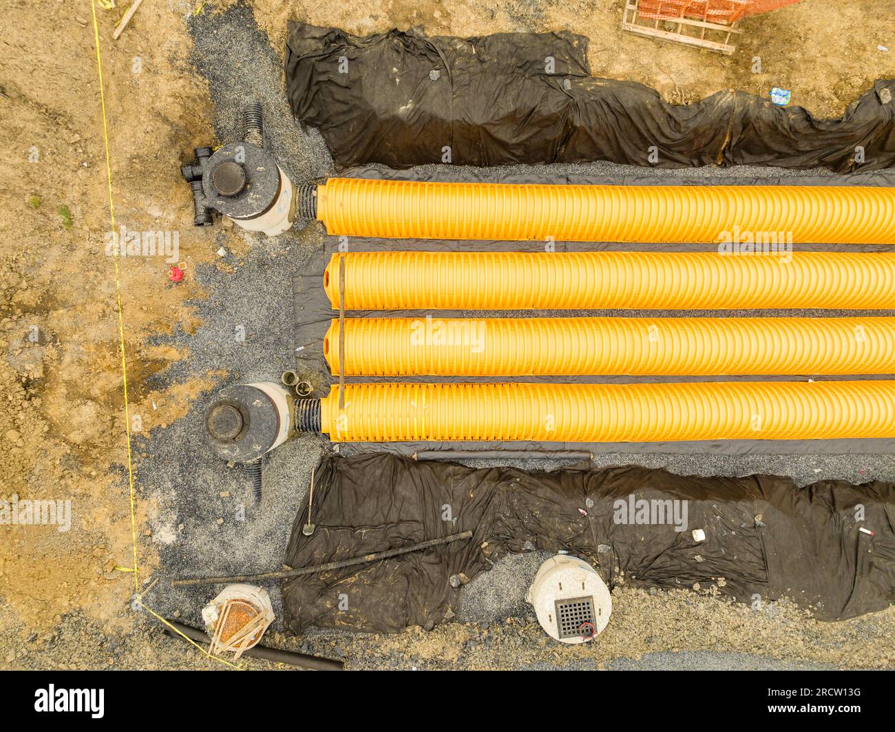 Yellow underground storm water detention mitigation units on a ...
