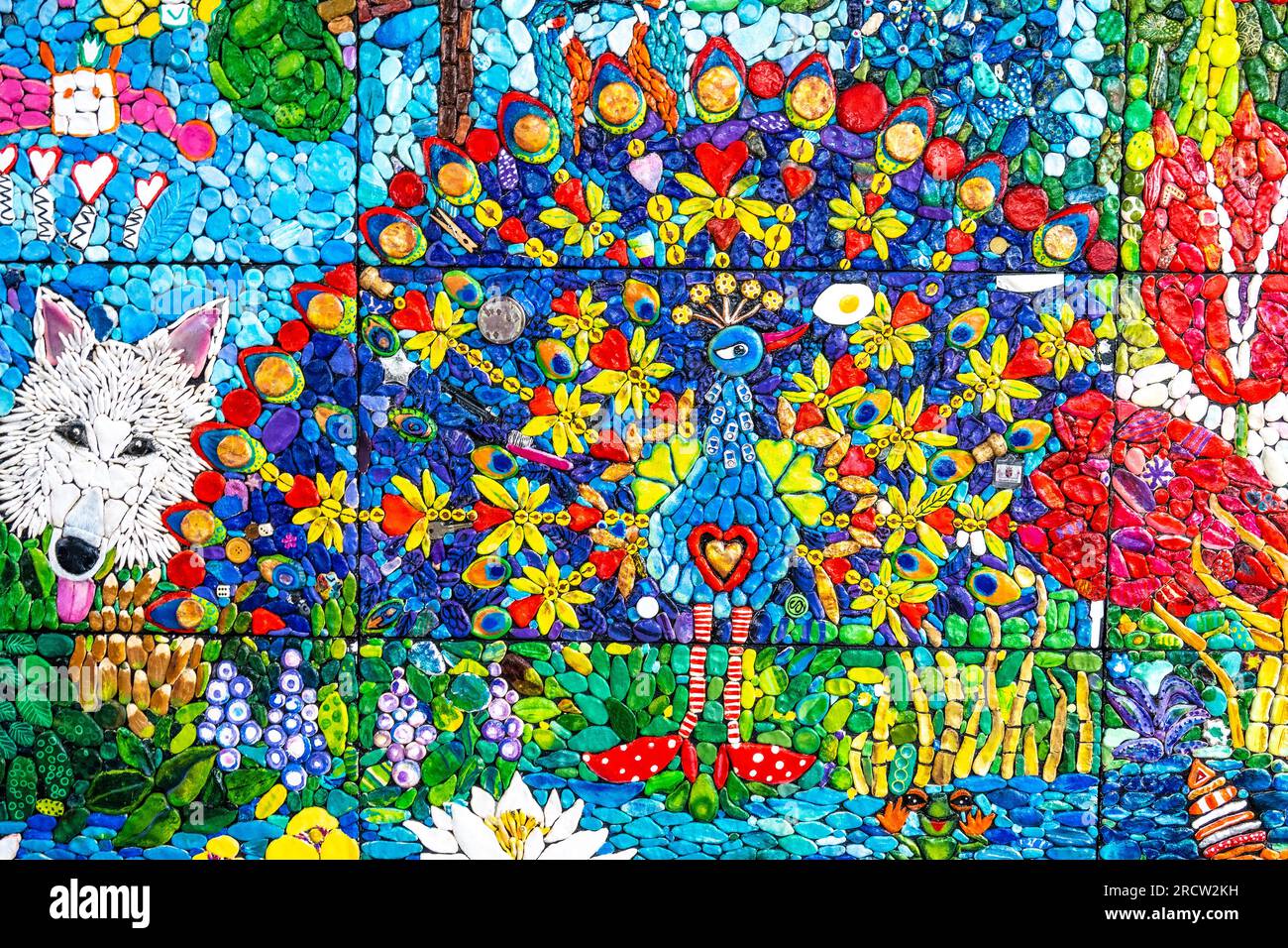 painted rock mosaic with a peacock and dog Stock Photo - Alamy