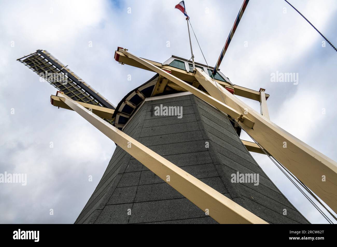 looking up at the Dutch windmill at the Keukenhof Gardens in Holland ...