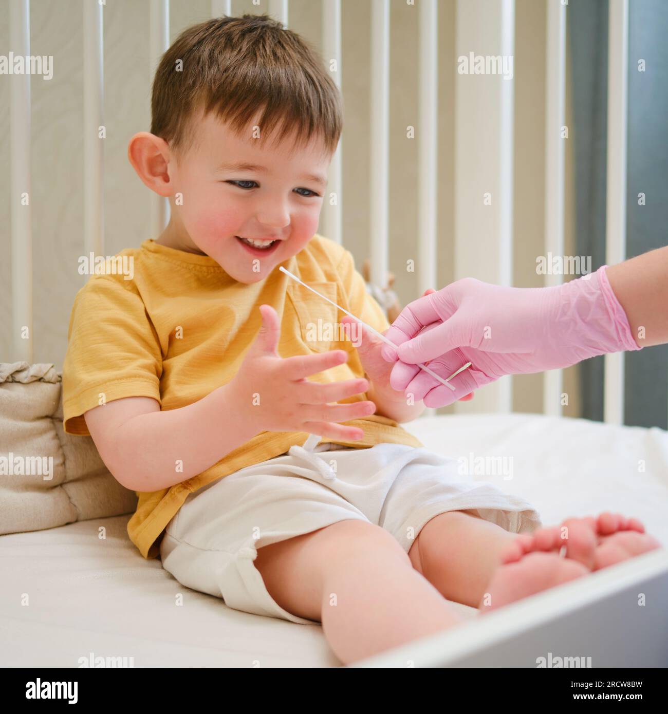 The pediatrician explained that taking a sample with a cotton swab from ...
