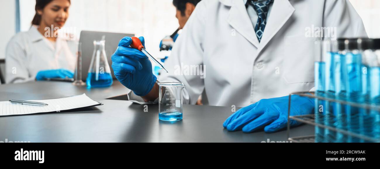 Group of dedicated scientist conduct chemical experiments and research ...