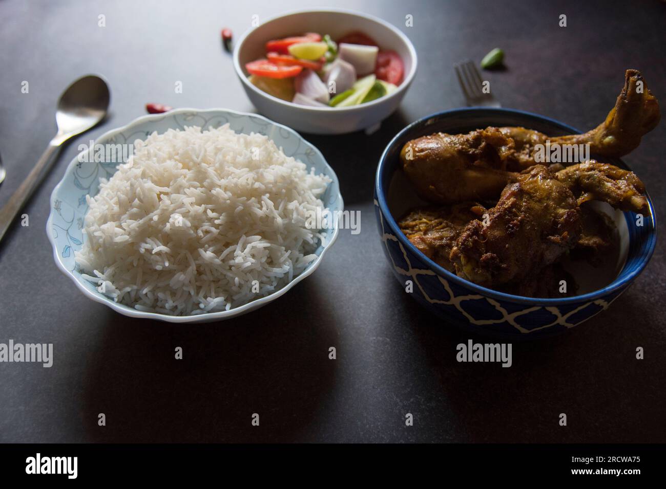 Indian lunch meal steamed rice and chicken curry served Stock Photo - Alamy