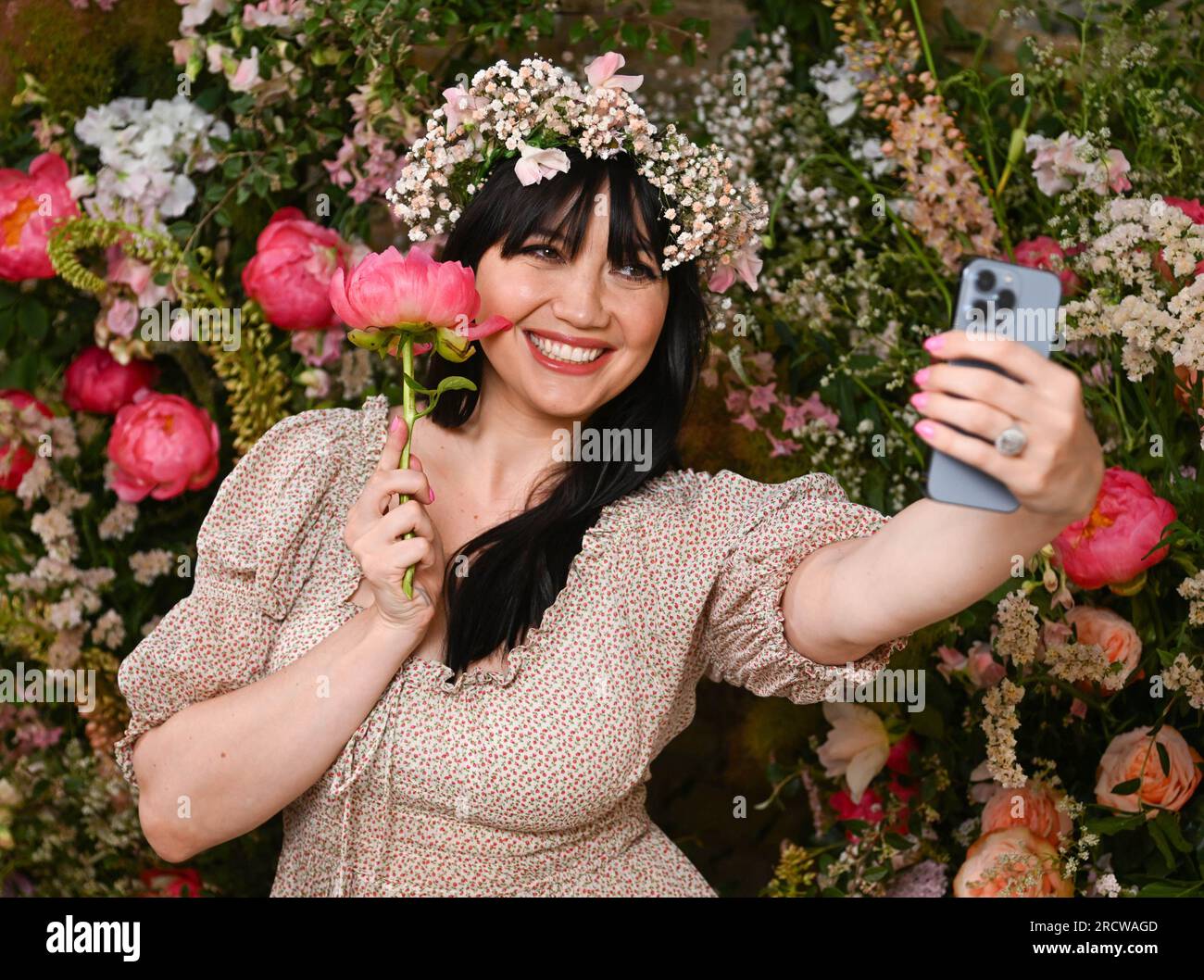 EDITORIAL USE ONLY Daisy Lowe models a flower crown ahead of her ...