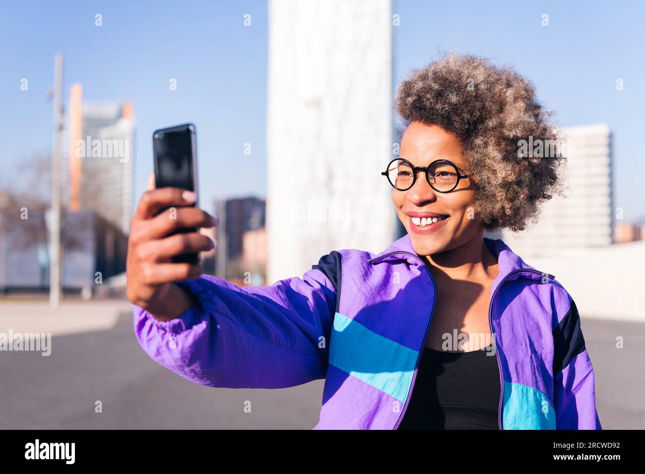 female runner taking a selfie with mobile phone Stock Photo - Alamy