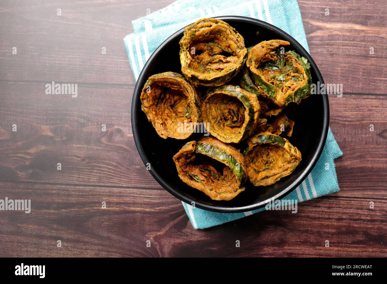 Dry Patra is an Indian dish made with colocasia leaves that are coated ...