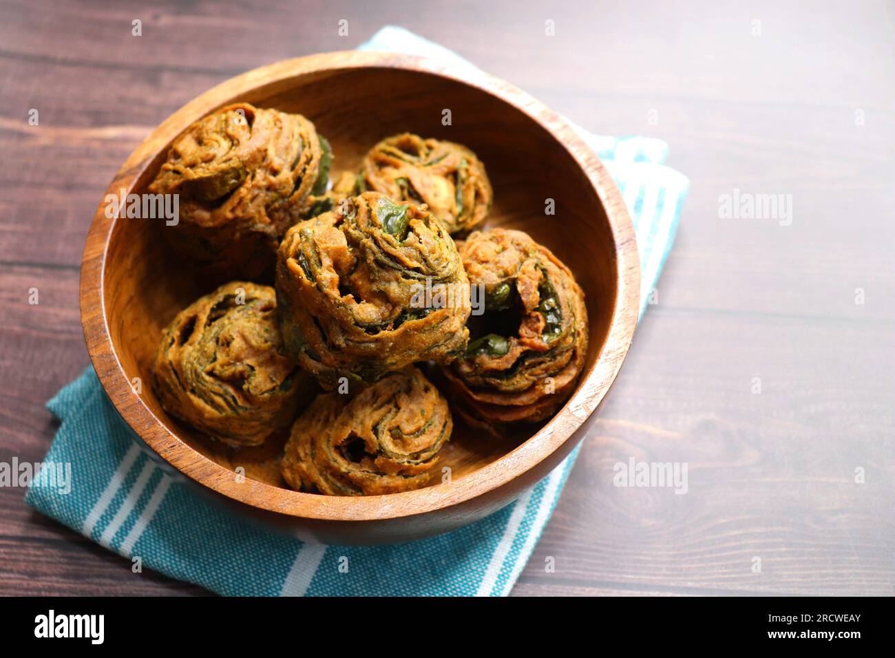 Dry Patra is an Indian dish made with colocasia leaves that are coated ...