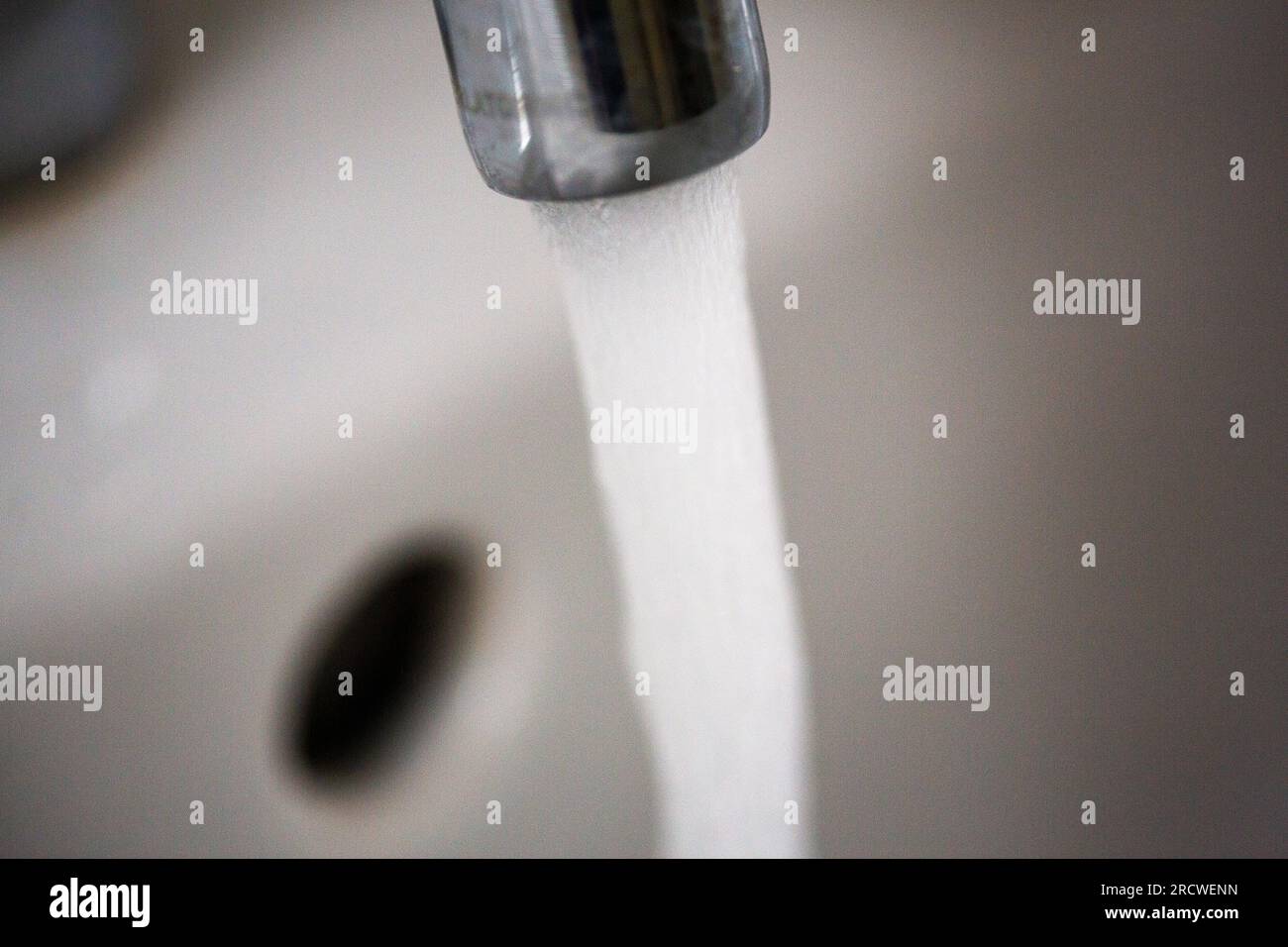 Berlin, Germany. 01st July, 2023. Tap water flows with pressure from ...