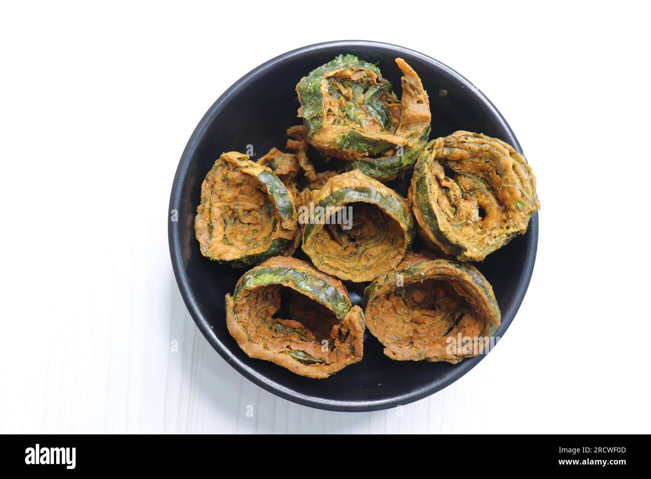 Dry Patra is an Indian dish made with colocasia leaves that are coated ...