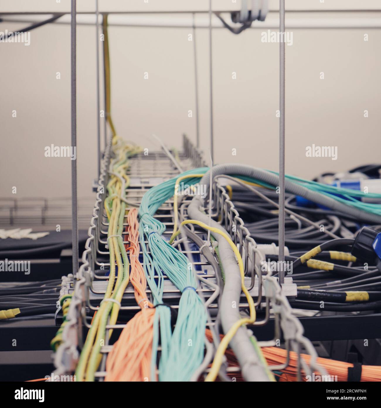 The ceiling of the server room is lined with cables to ensure reliable ...