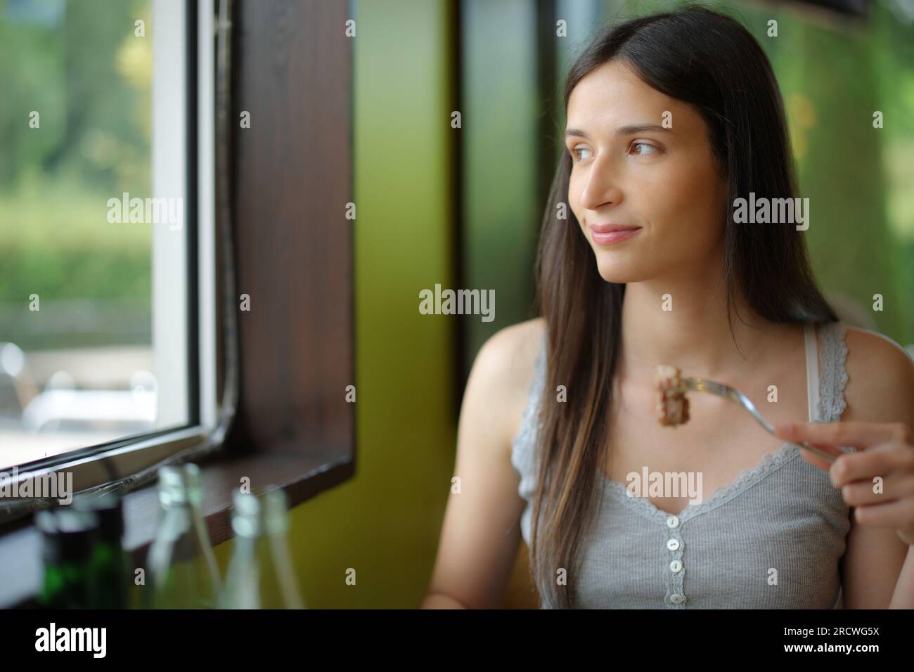 Beautiful girl eating restaurant looking hi-res stock photography and ...
