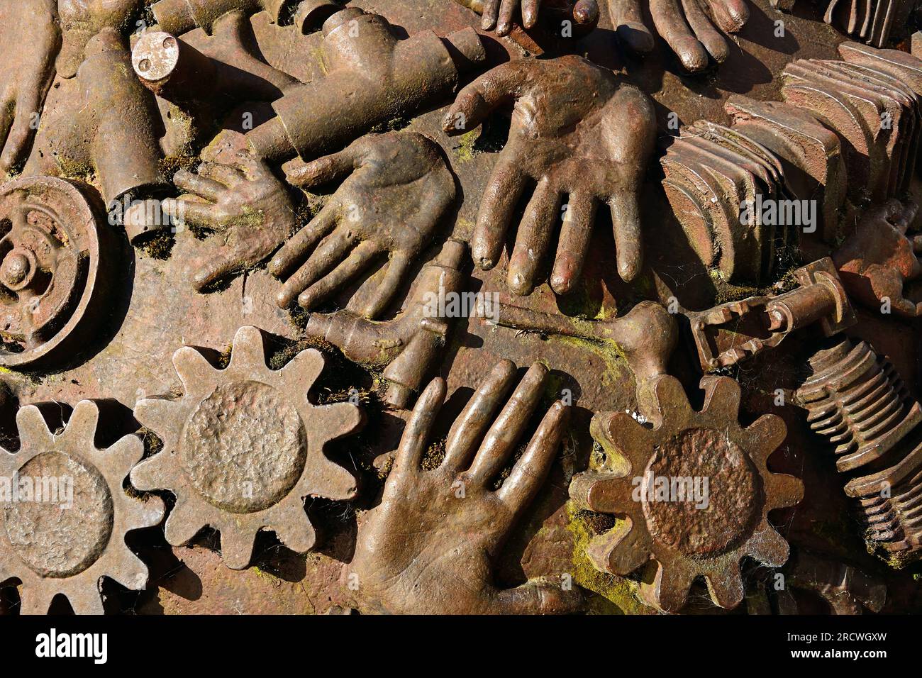 Hand casts and cogs detail on the boulder statue by Neville Cable along ...
