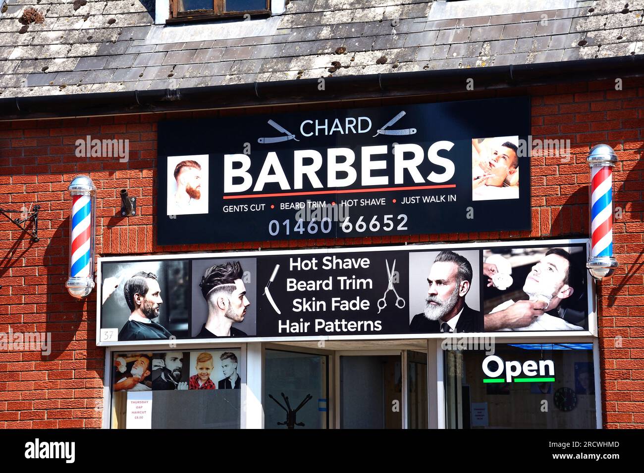 Barbers poles and signs outside a Turkish barbers shop along Fore ...