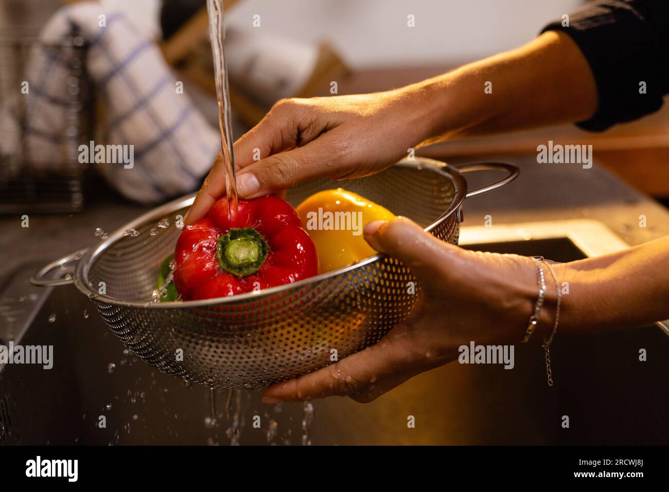 Woman washing vegetables cook hi-res stock photography and images - Alamy