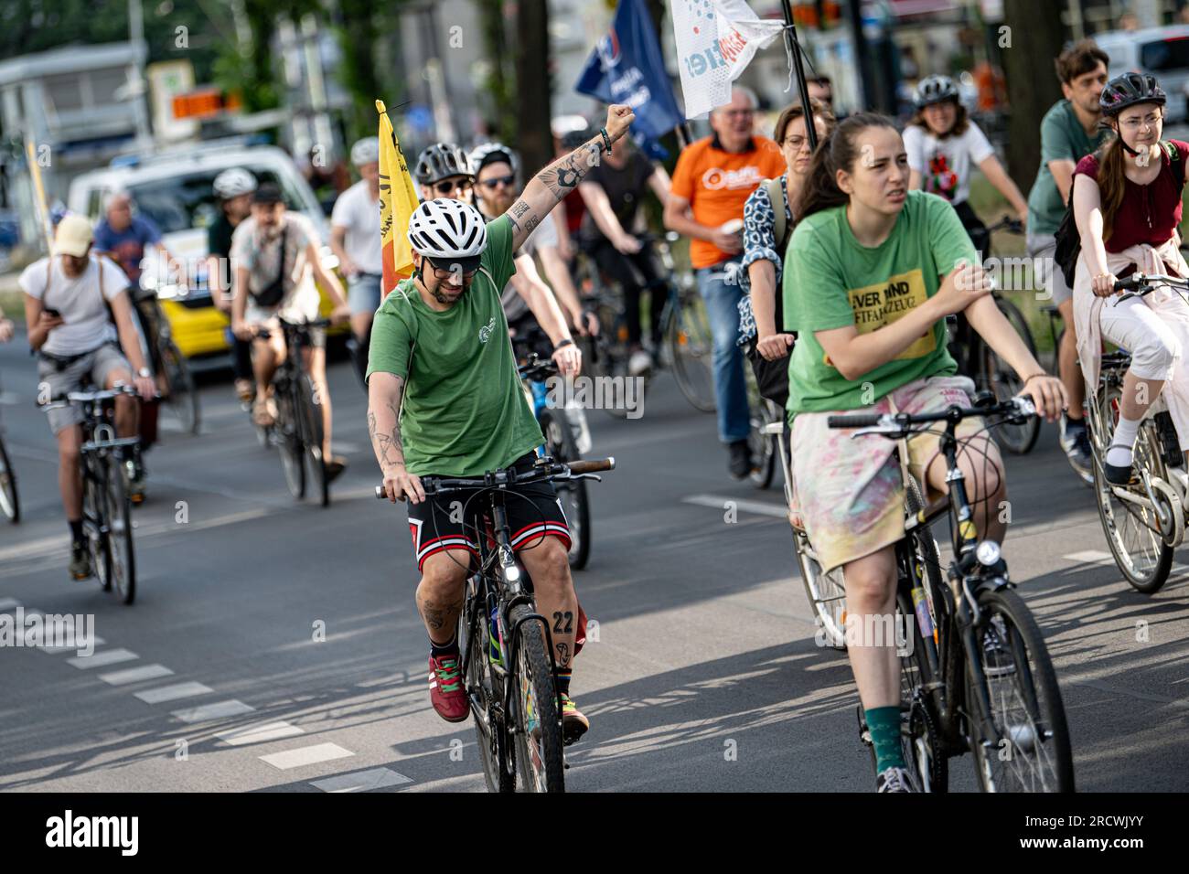 Berlin, Germany. 17th July, 2023. A cyclist raises his fist at a ...
