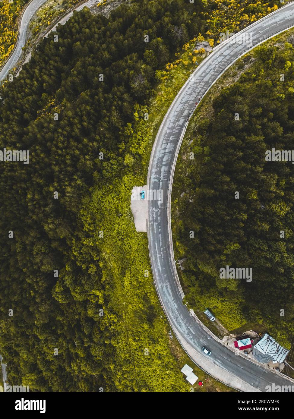 Aerial View of Mountain Road Surrounded by Forest Stock Photo - Alamy