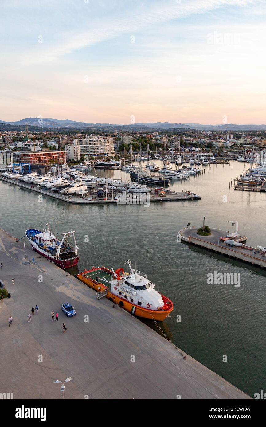 Aerial view of harbour, city and coastline at sunset seen from ...