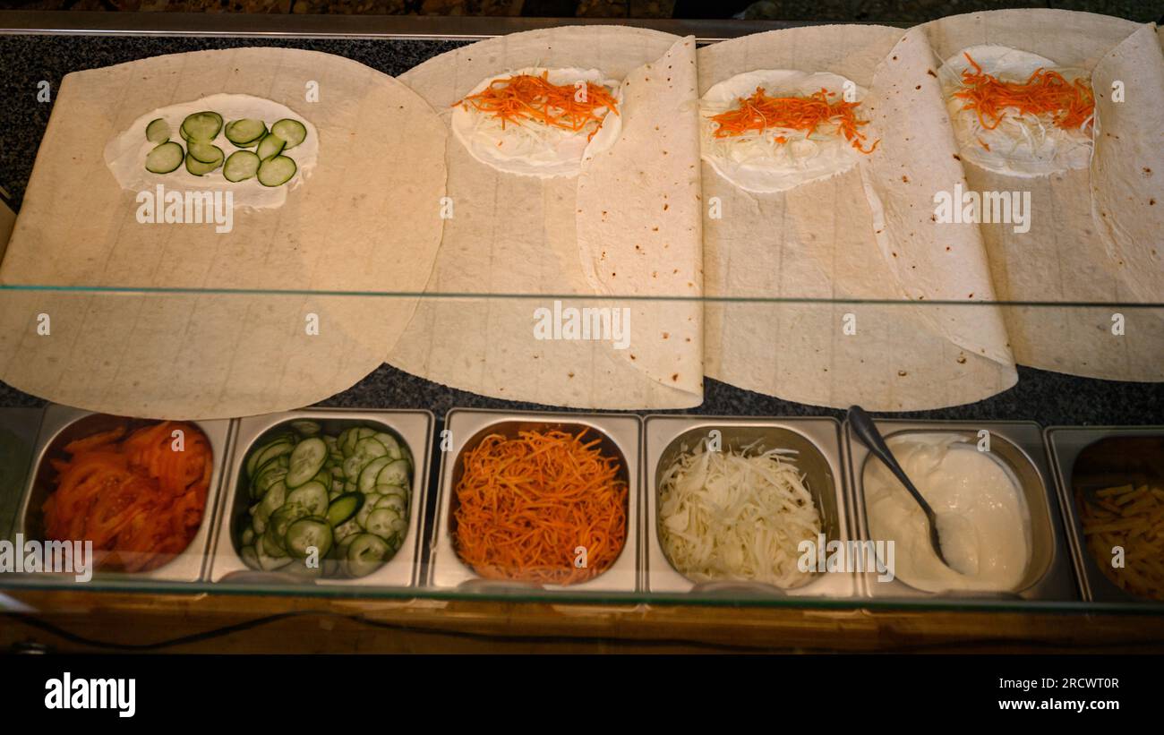 Shawarma preparation in a fast food restaurant, vegetable and meat ...