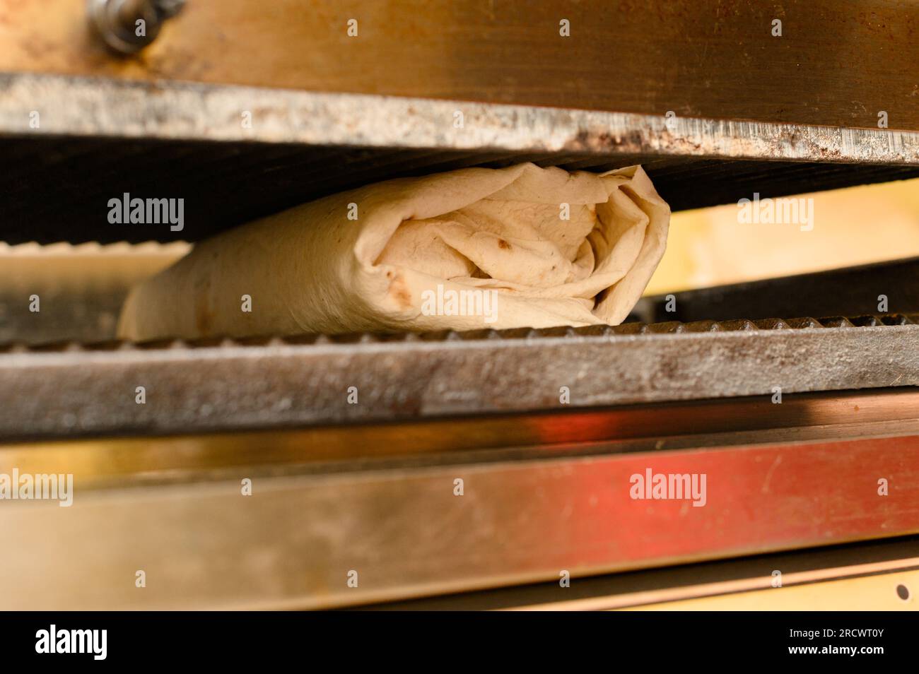 Warming up and final cooking of shawarma on the grill close-up, hot ...