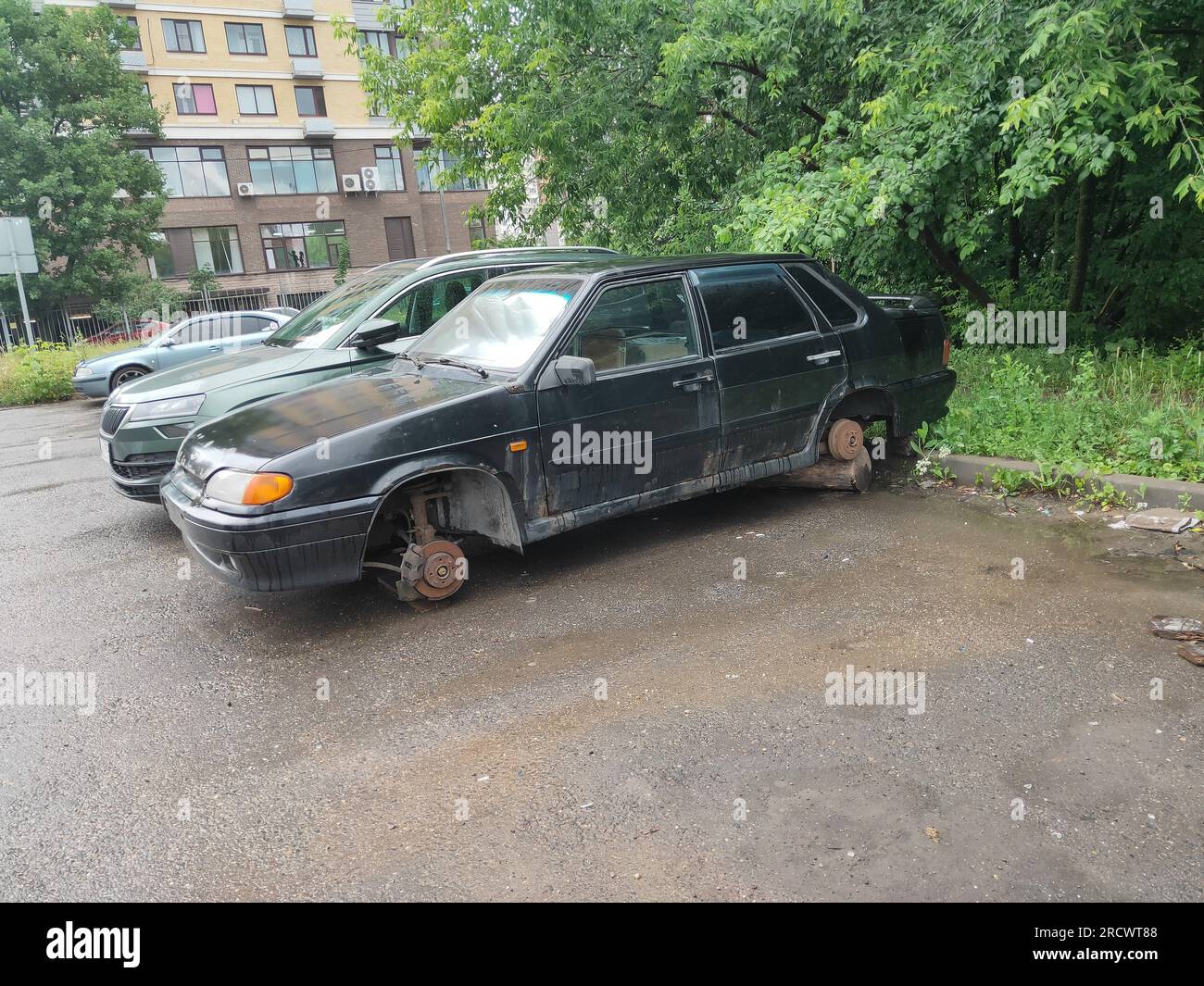Moscow. Car VAZ-2115 without wheels in the yard in the parking lot ...