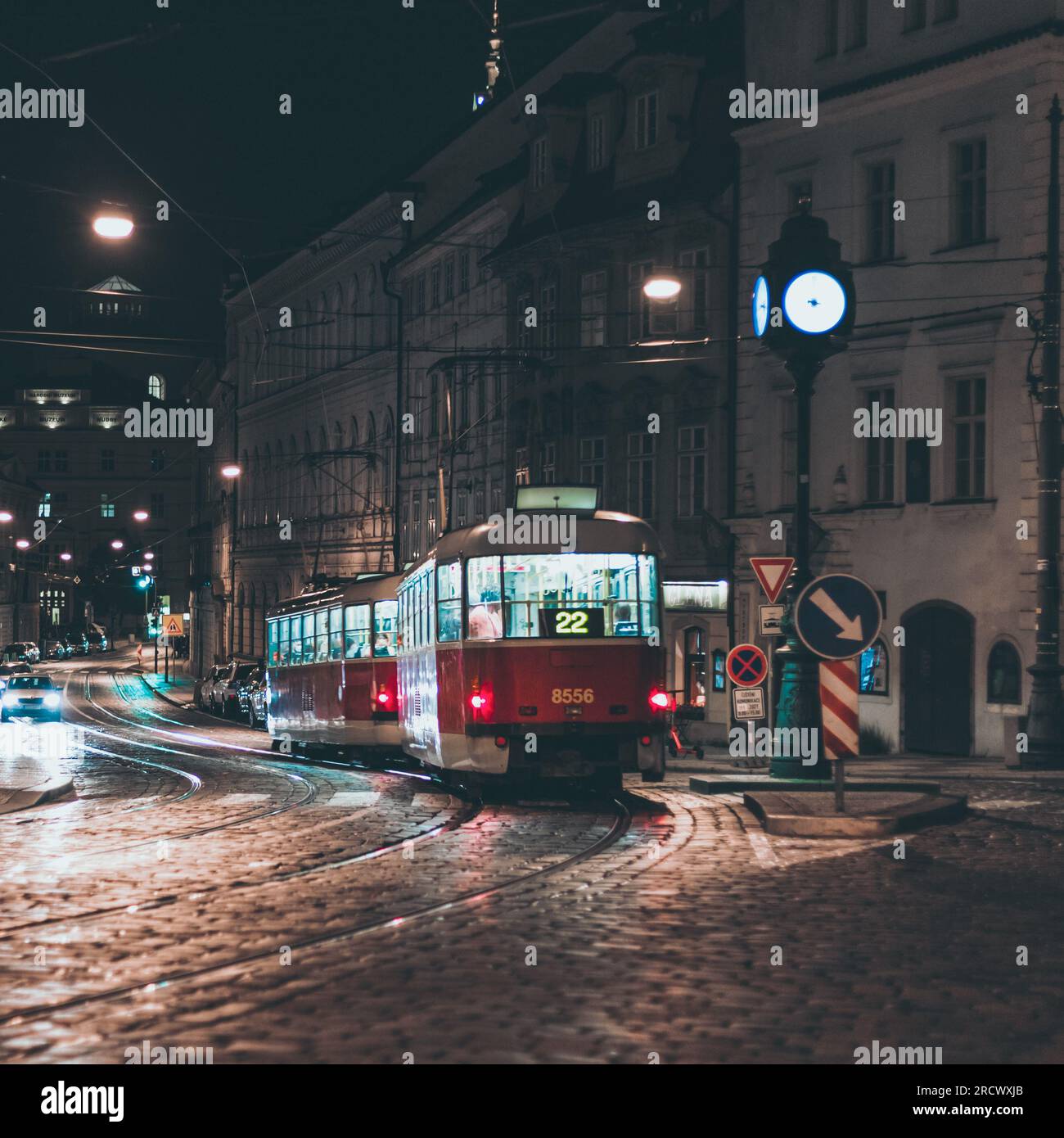 red tram in motion on city street at night Stock Photo - Alamy