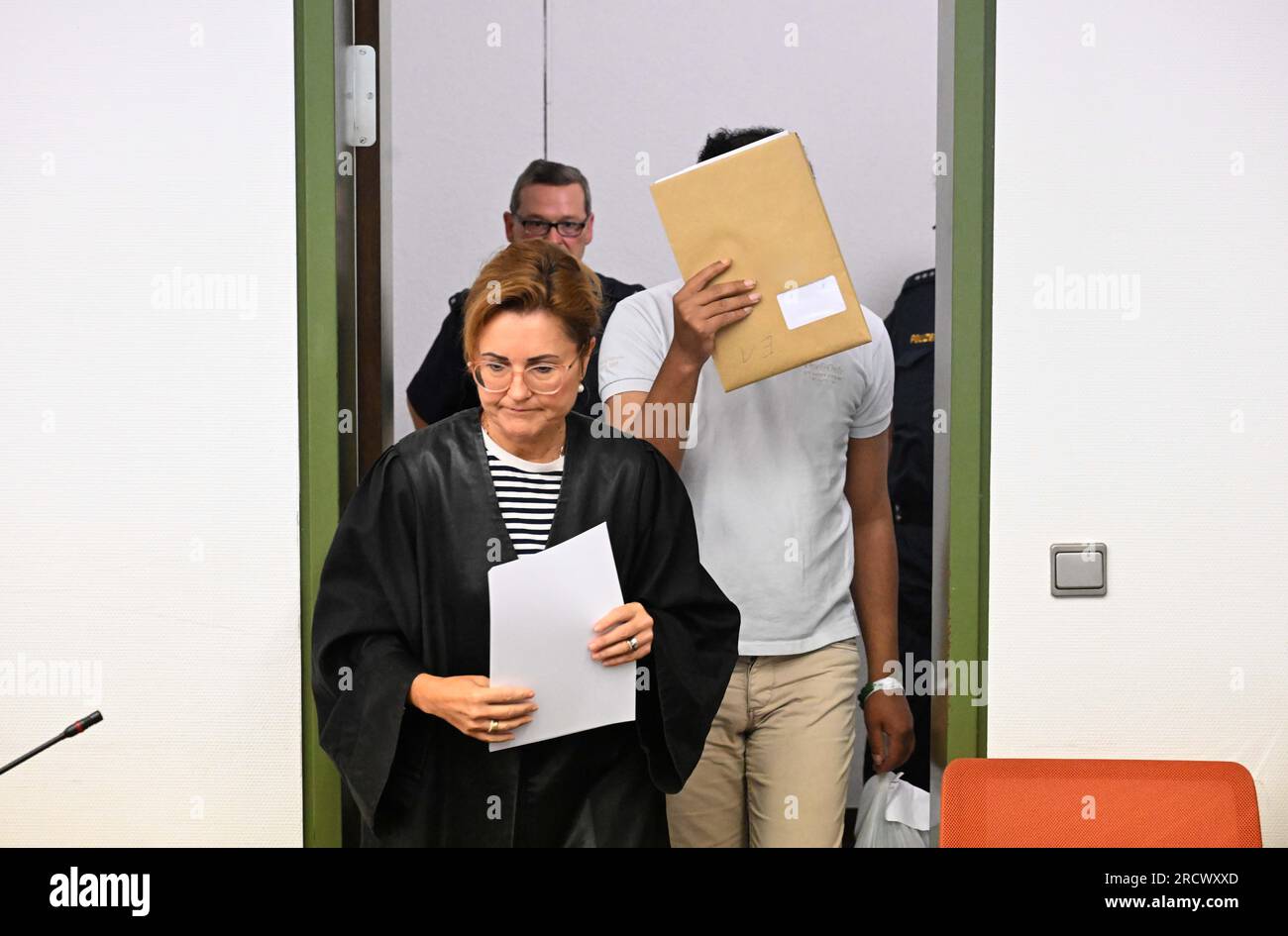 Munich, Germany. 17th July, 2023. The defendant (r) arrives with his ...