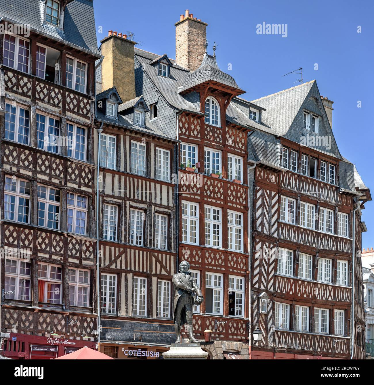half-timbered houses and a statue of Jean Leperdit at the Place du ...