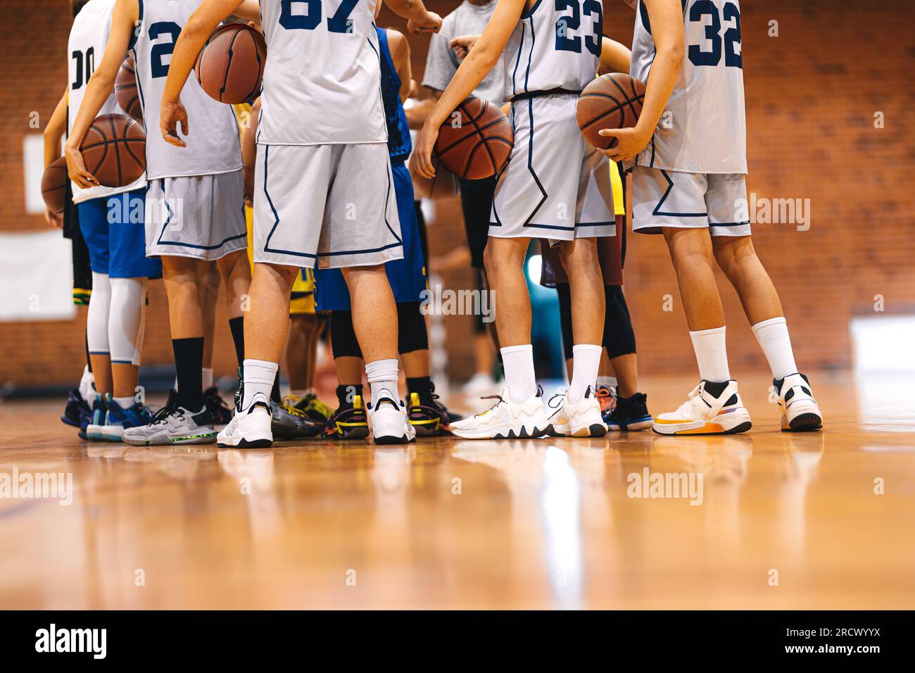Strength In Unity Basketball Team Huddling Together For Victory Youth Players In Basketball 