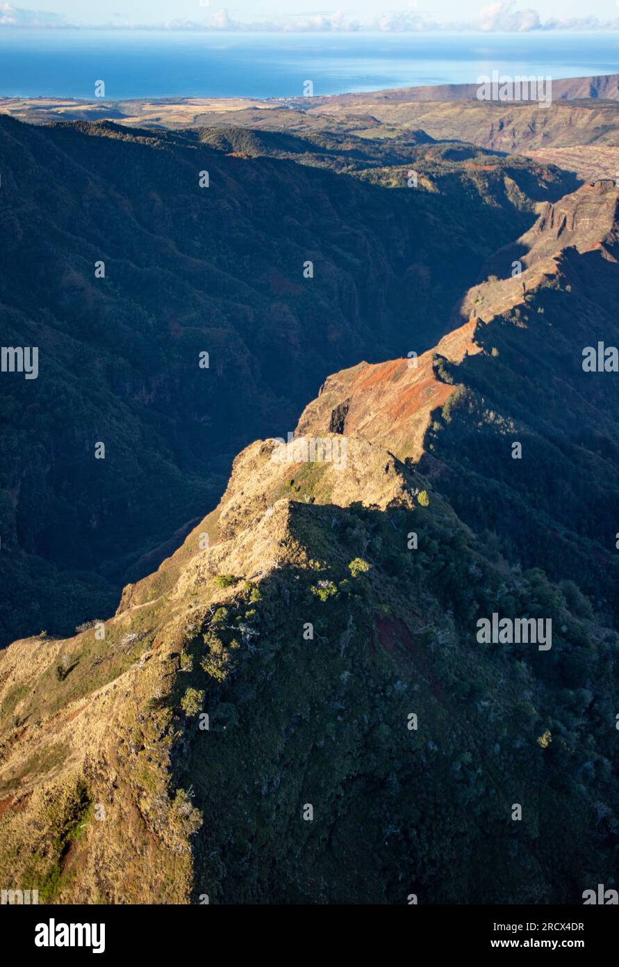 Flying over the canyons of Kauai in a helicopter Stock Photo - Alamy