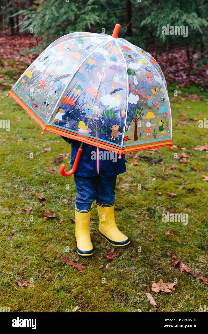 Hiding under jacket hi-res stock photography and images - Alamy