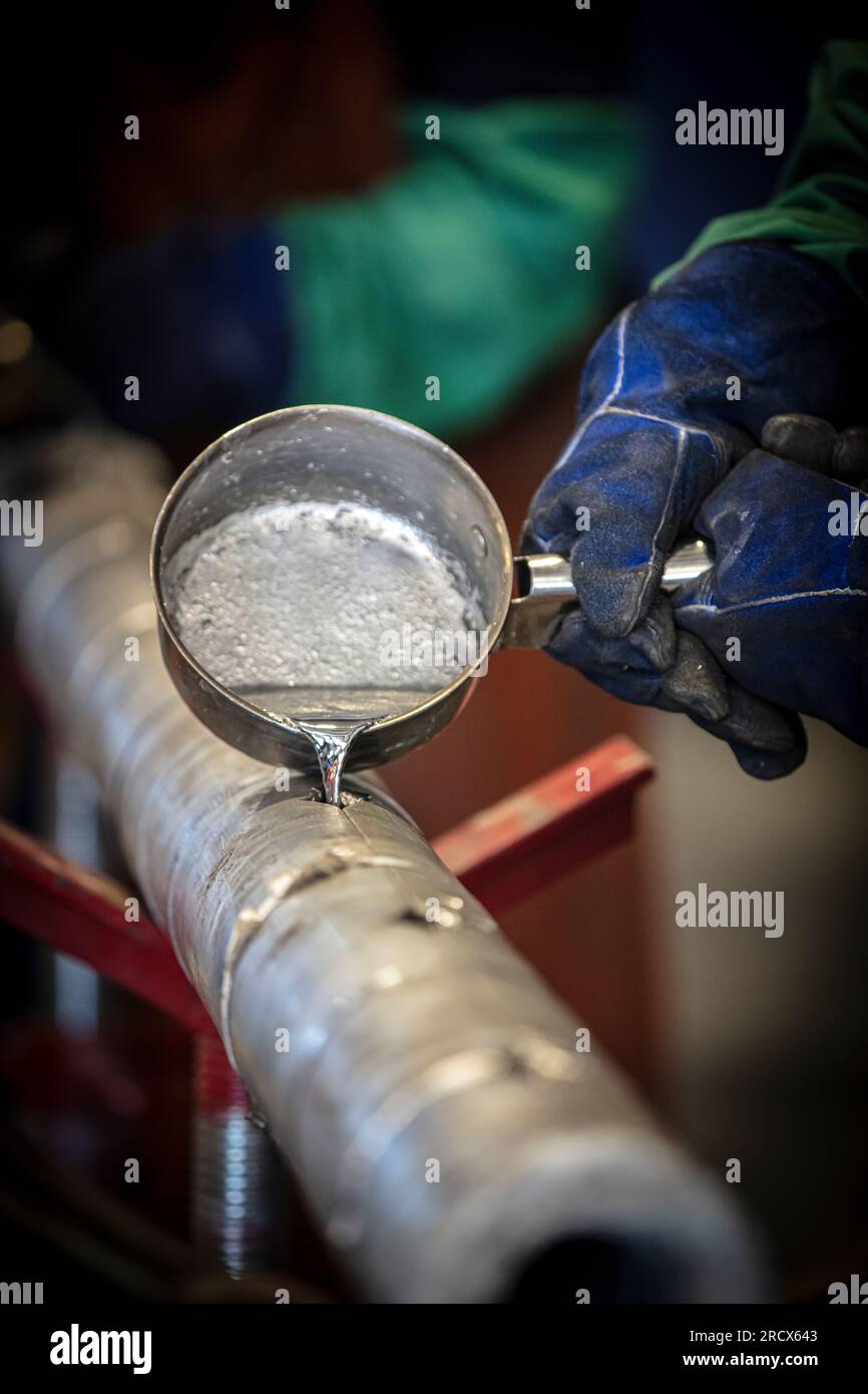 Molten Metal Poured into Mold Stock Photo - Alamy