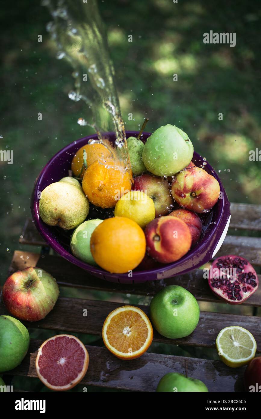 Fruit washing in nature Stock Photo - Alamy