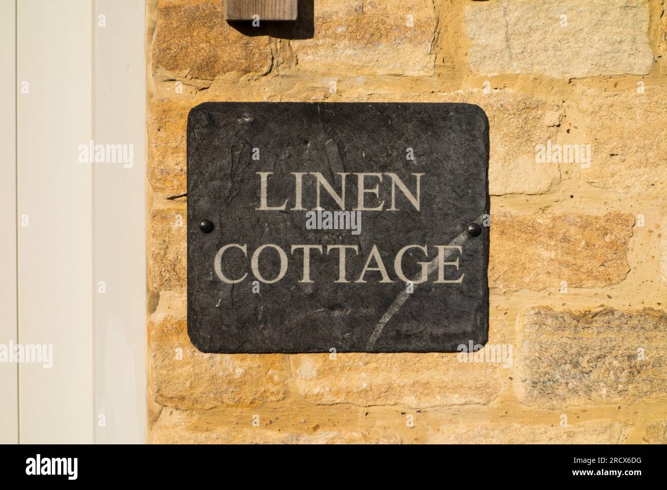 Linen Cottage sign, Gloucestershire, UK Stock Photo - Alamy