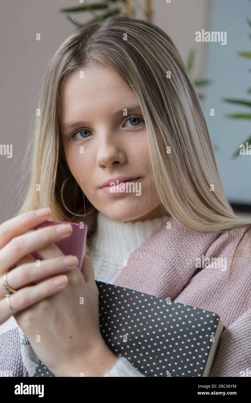 Beautiful blonde college student Stock Photo - Alamy