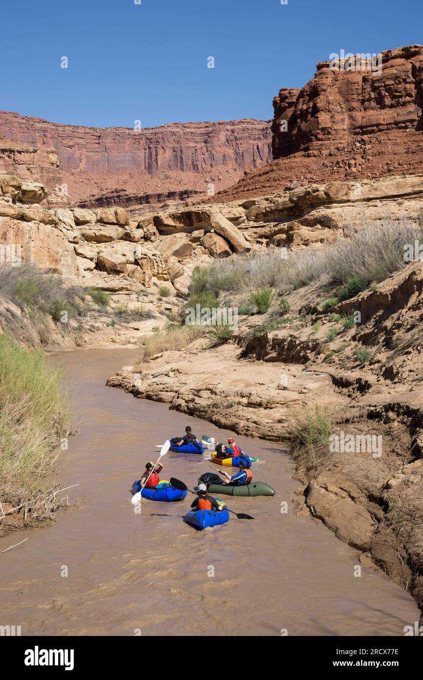 A group of women pack rafting on a desert river Stock Photo - Alamy