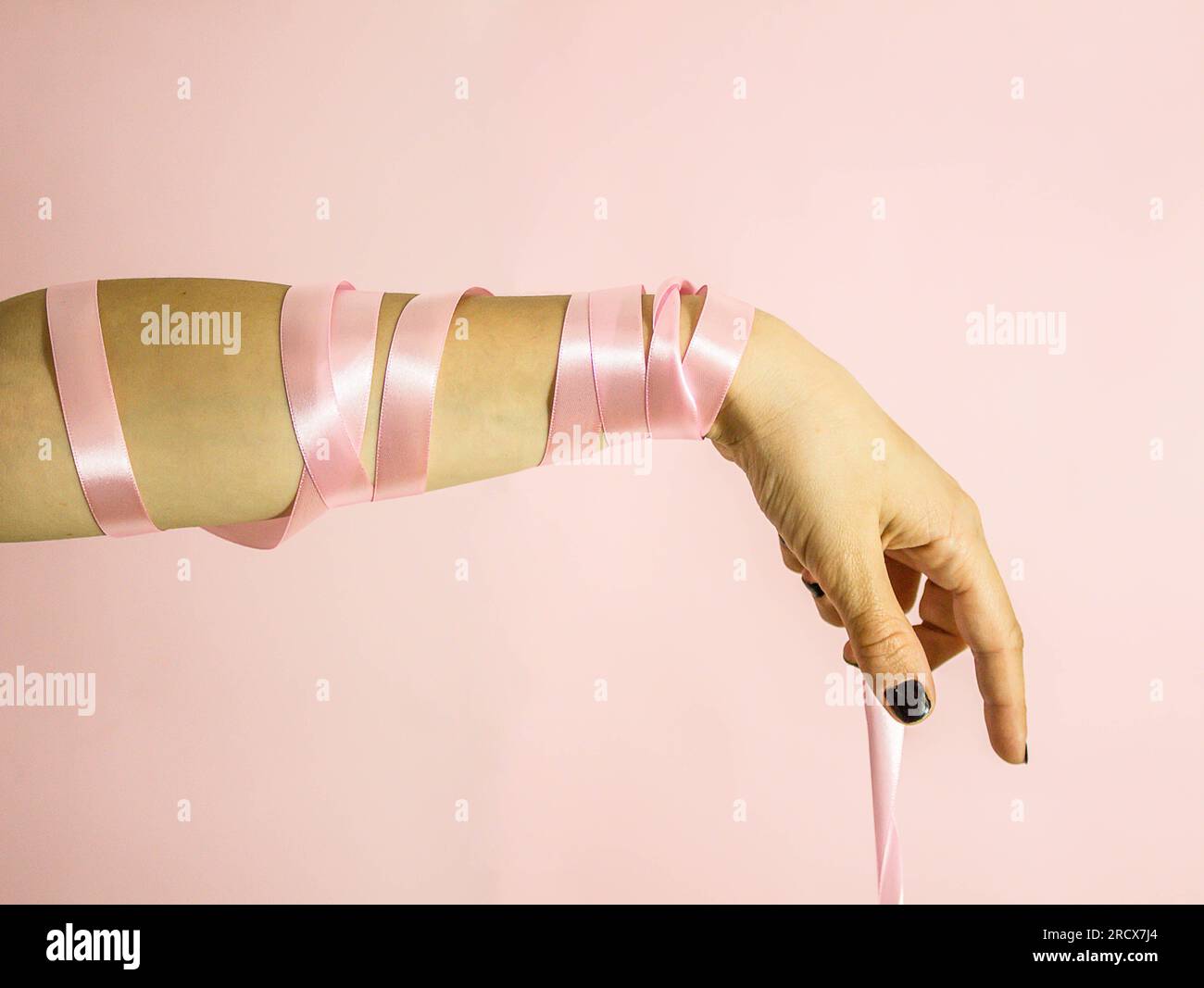 woman's arm with pink bow Stock Photo - Alamy