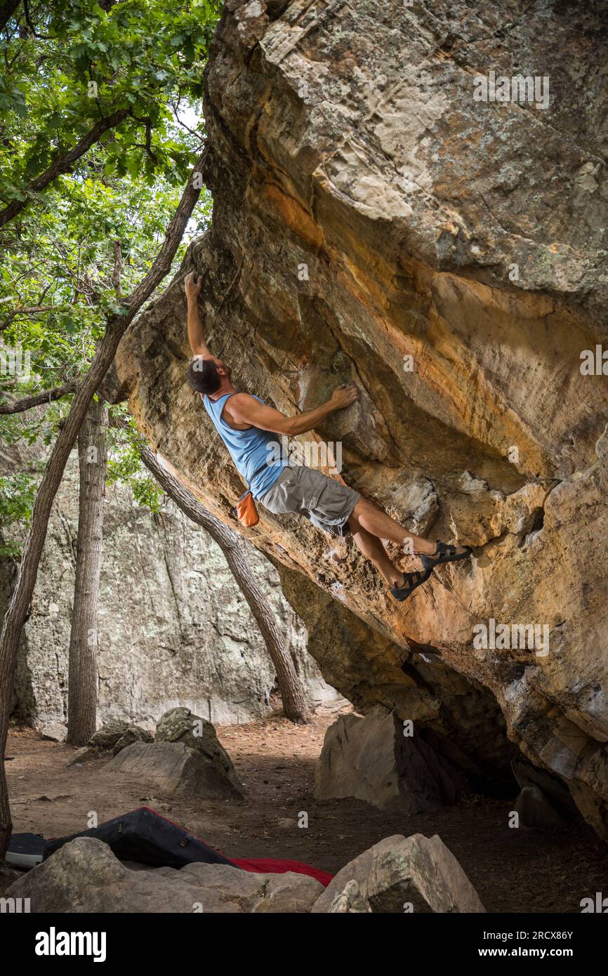 A man bouldering Stock Photo - Alamy