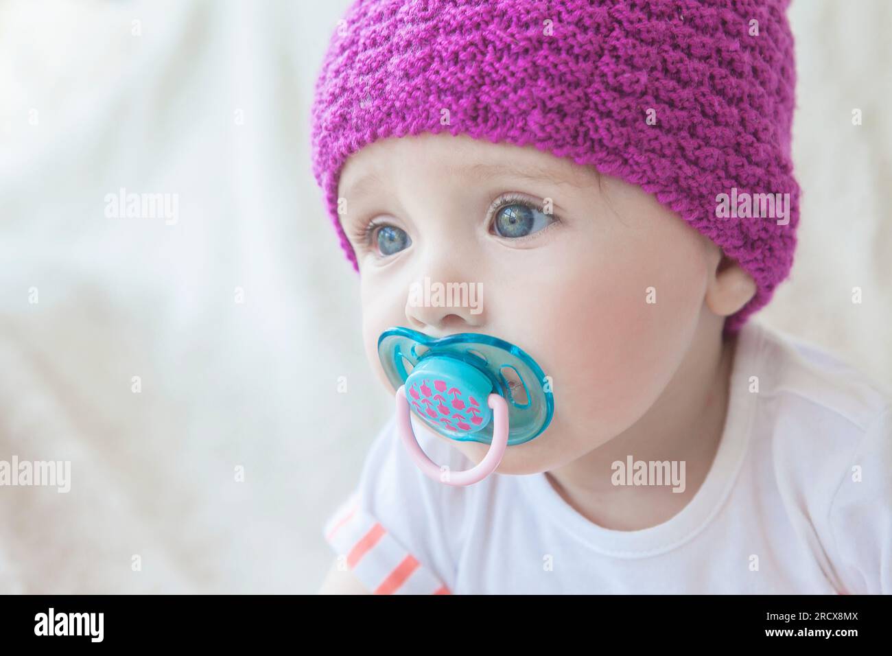 Little baby girl contemplative at home Stock Photo - Alamy