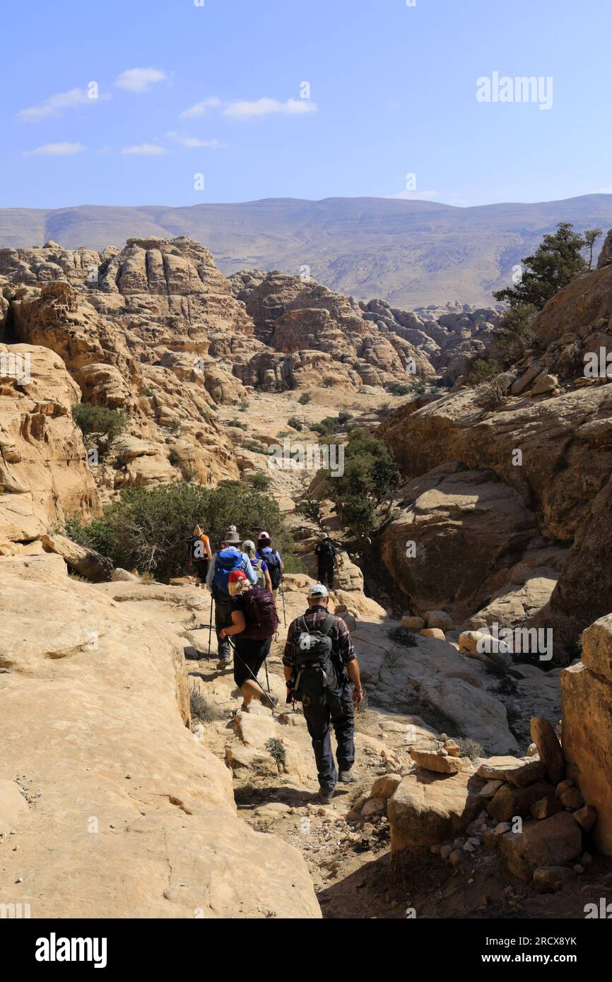 Walkers in the Wadi al-Aghlat before Little Petra, Jordan, Middle East ...