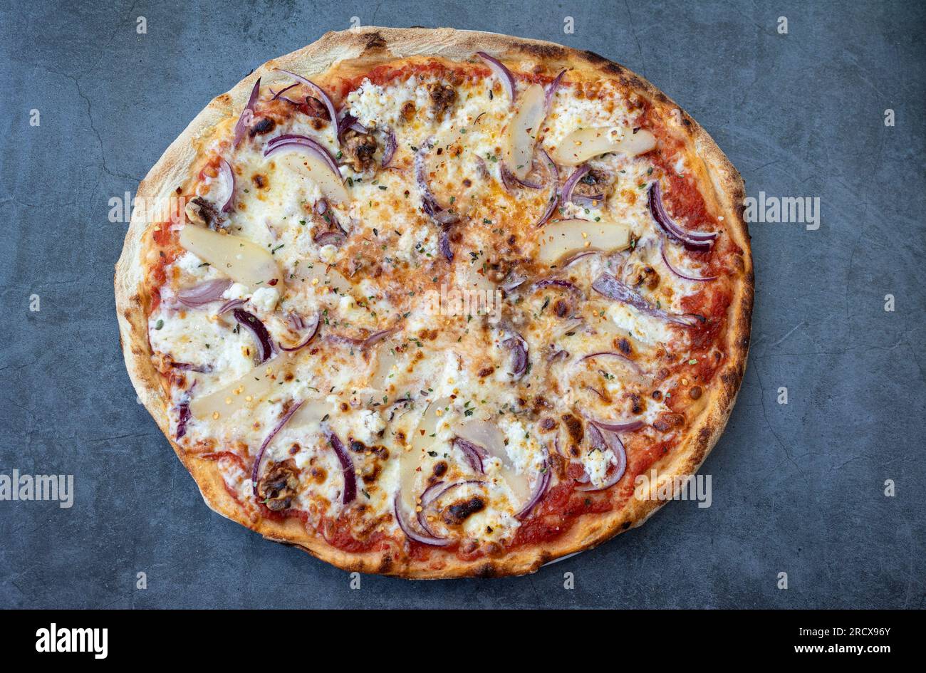 Italian food specialty Pizza with goat cheese red onion honey and ...