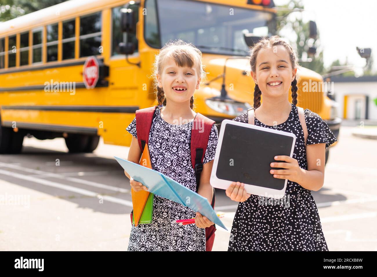 Basic school students crossing the road Stock Photo - Alamy