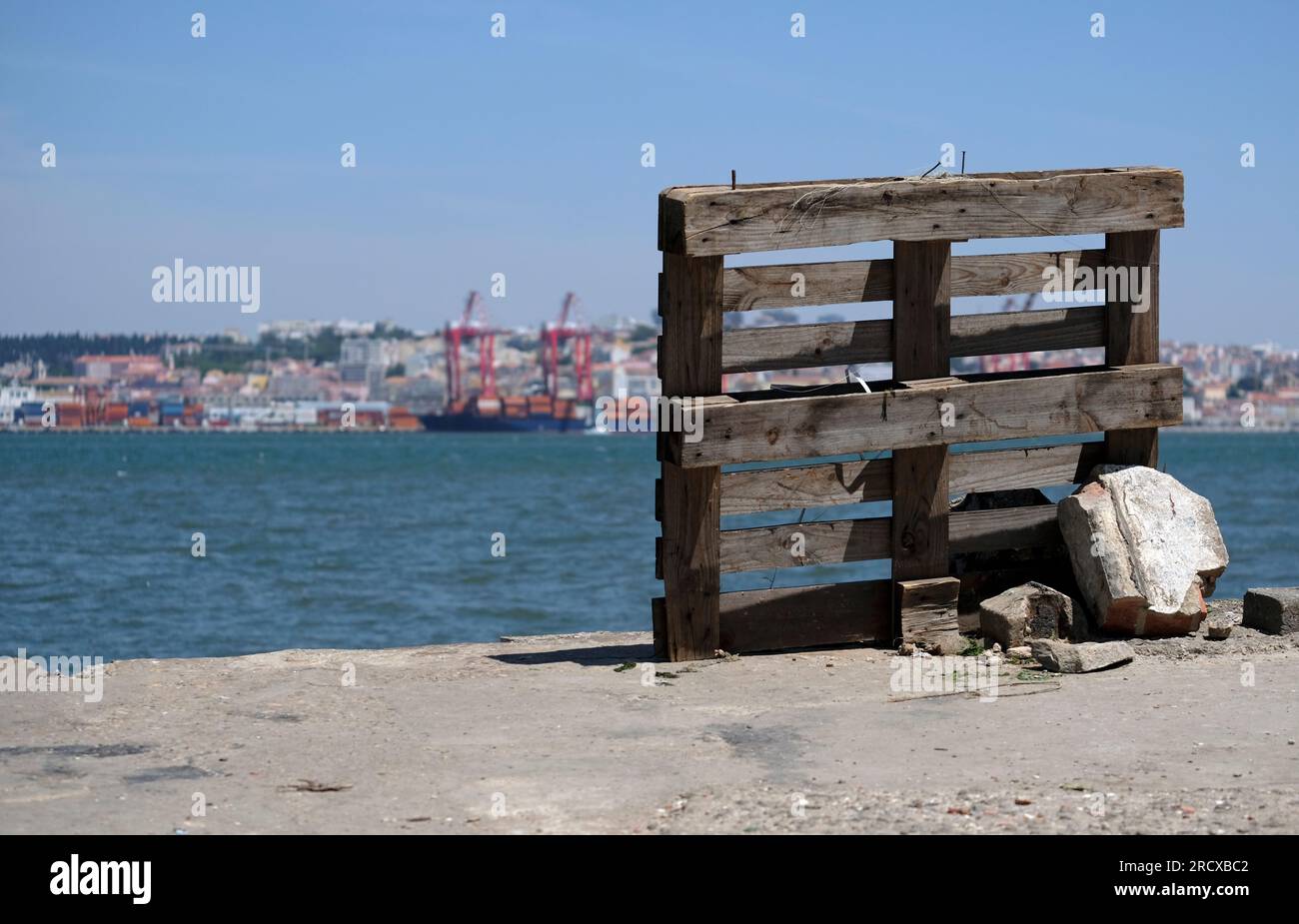 Lisbon harbor view with wooden pallet on a pier Stock Photo - Alamy