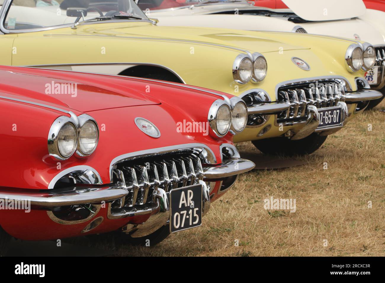 front of classic Chevrolet Corvette convertible cars at old timer day in Lelystad, the ...