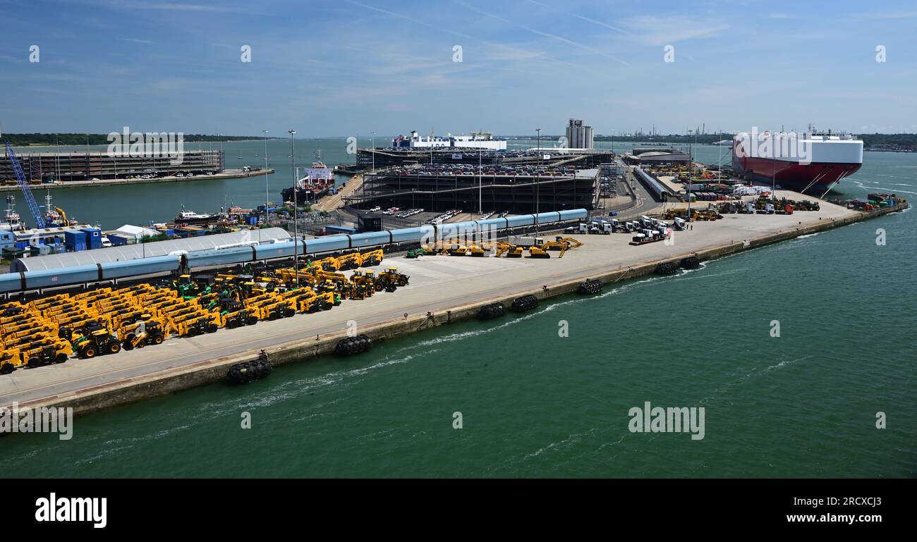 A car carrier train and yellow JCB's on the quayside at Southampton ...