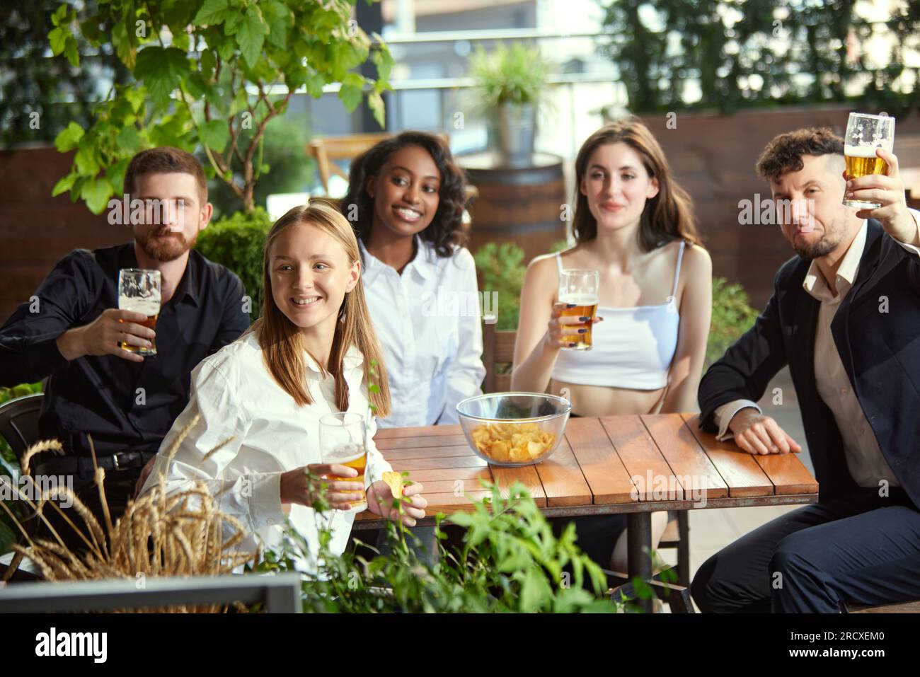 Beautiful, cheerful young people, colleagues, business people meeting ...