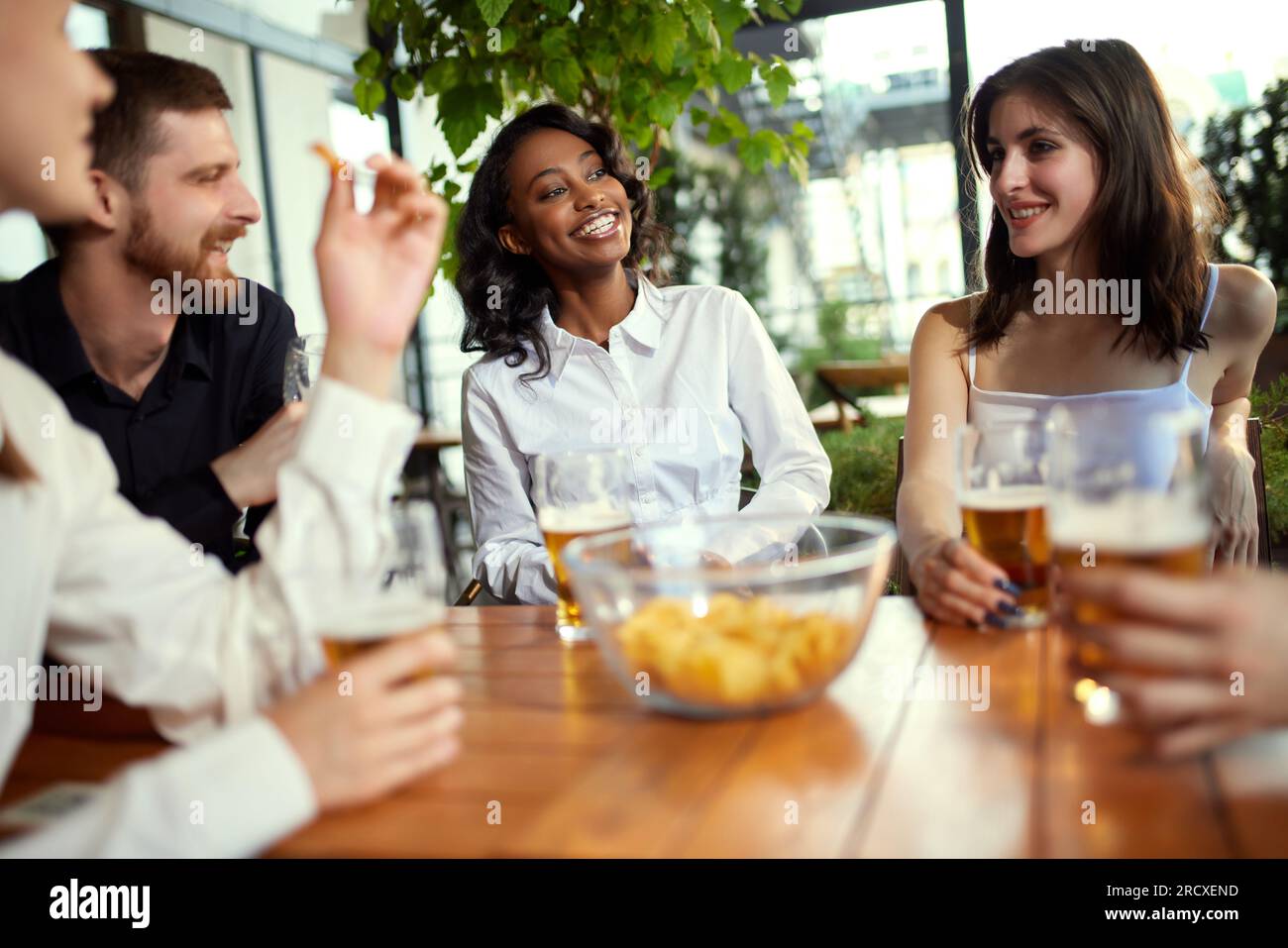 Drink after work happy colleagues hi-res stock photography and images ...