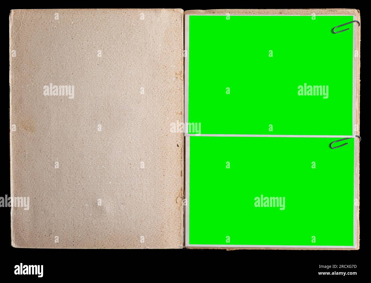 A vintage book page with blank photo frames attached with paper clips ...