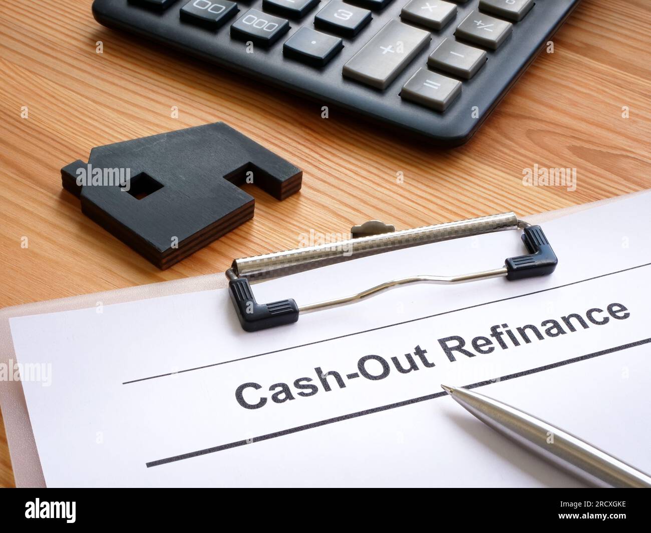 Application for cash out refinance and model of house Stock Photo - Alamy