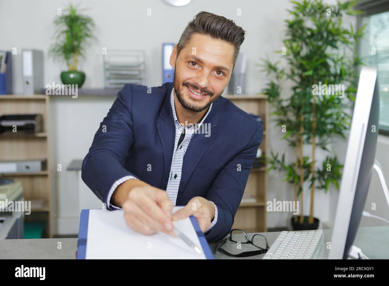 office worker asking for signature Stock Photo - Alamy