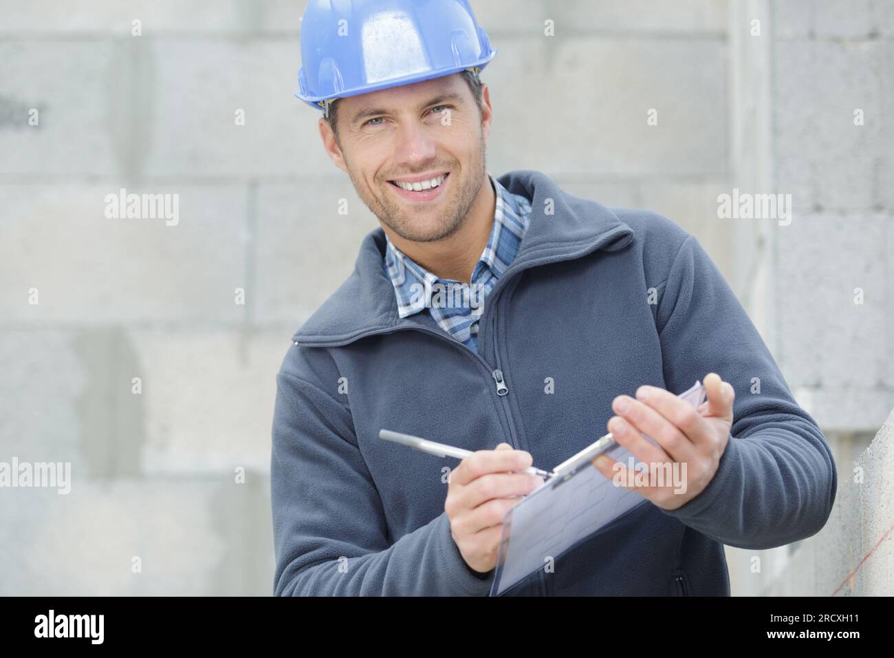 happy handsome engineer construction worker Stock Photo - Alamy